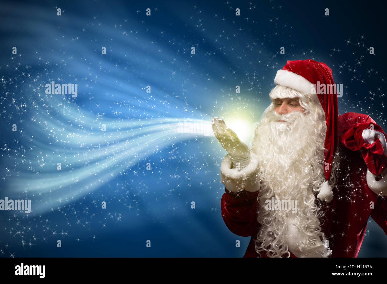 Santa Claus and the magic Stock Photo - Alamy