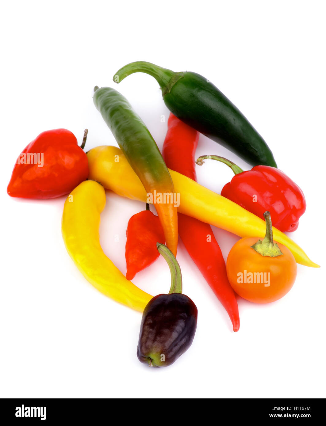 Yellow peppers on black Cut Out Stock Images & Pictures - Alamy