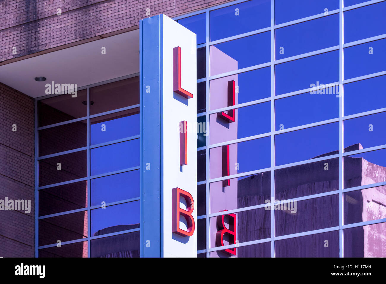 Reflections on a glass building in a city Stock Photo - Alamy