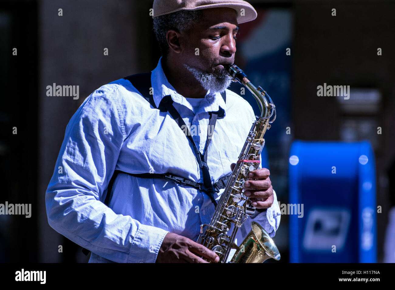 Street performer playing the saxophone Stock Photo - Alamy