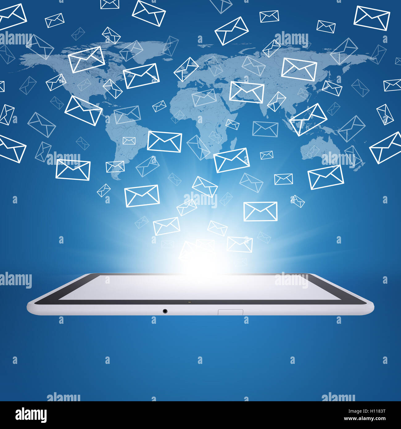 Emails fly out of tablet pc screen Stock Photo - Alamy
