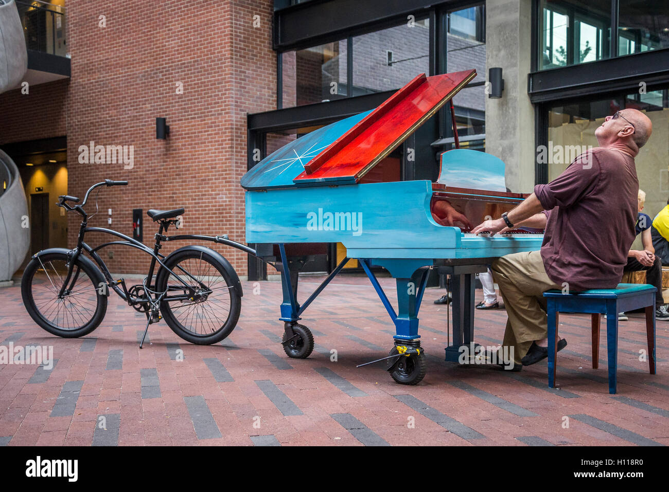 Man plays bicycle towed, Keys to the Streets Piano, Woodward’s Atrium ...