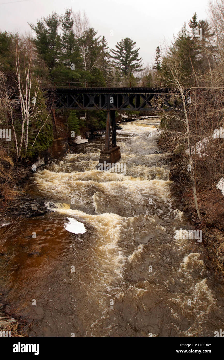 Rustic Steel Railroad Bridge over the Falls River Stock Photo - Alamy