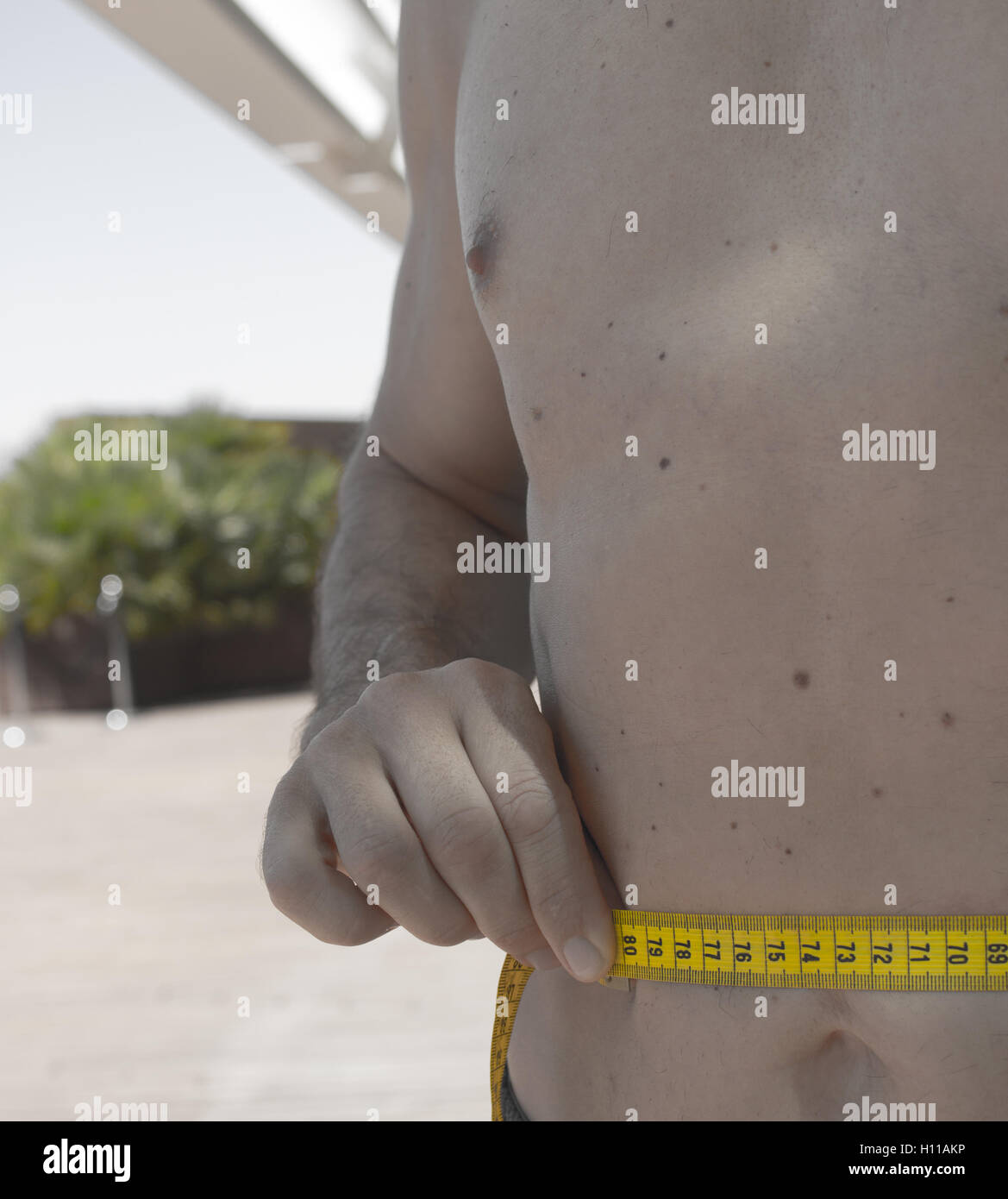 Body of a man measuring contour and body fat Stock Photo - Alamy