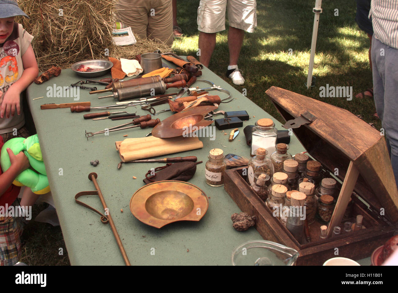 Original old pharmaceutical bottles in box and old medical instruments ...