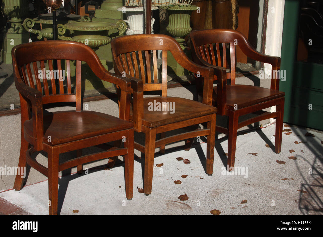 Three wooden chairs Stock Photo - Alamy