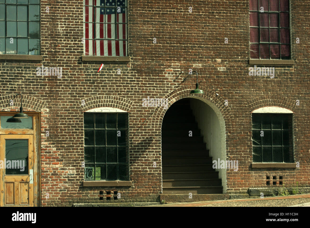 Lynchburg, VA, USA. Old brick building with covered steps and American ...