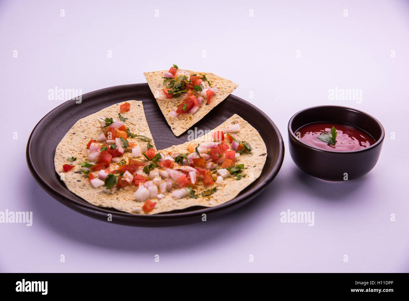 masala papad or roll papad indian vegetarian crispy food or starter ...