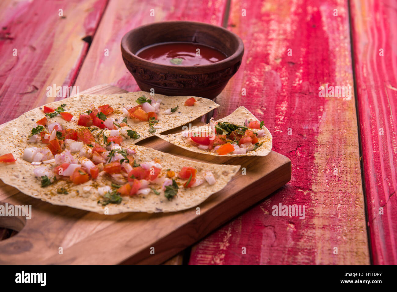 masala papad or roll papad indian vegetarian crispy food or starter ...