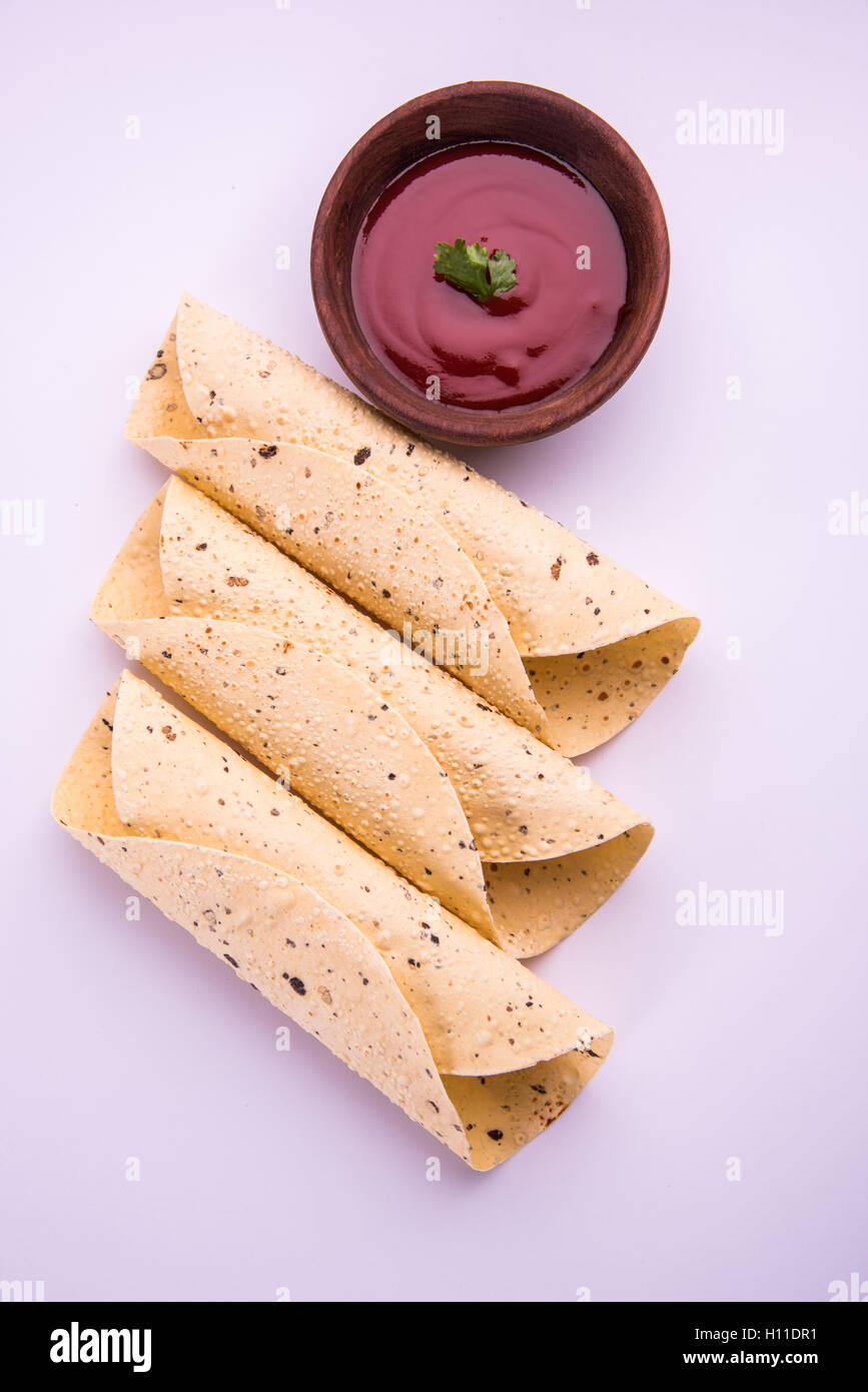 masala papad or roll papad indian vegetarian crispy food or starter ...