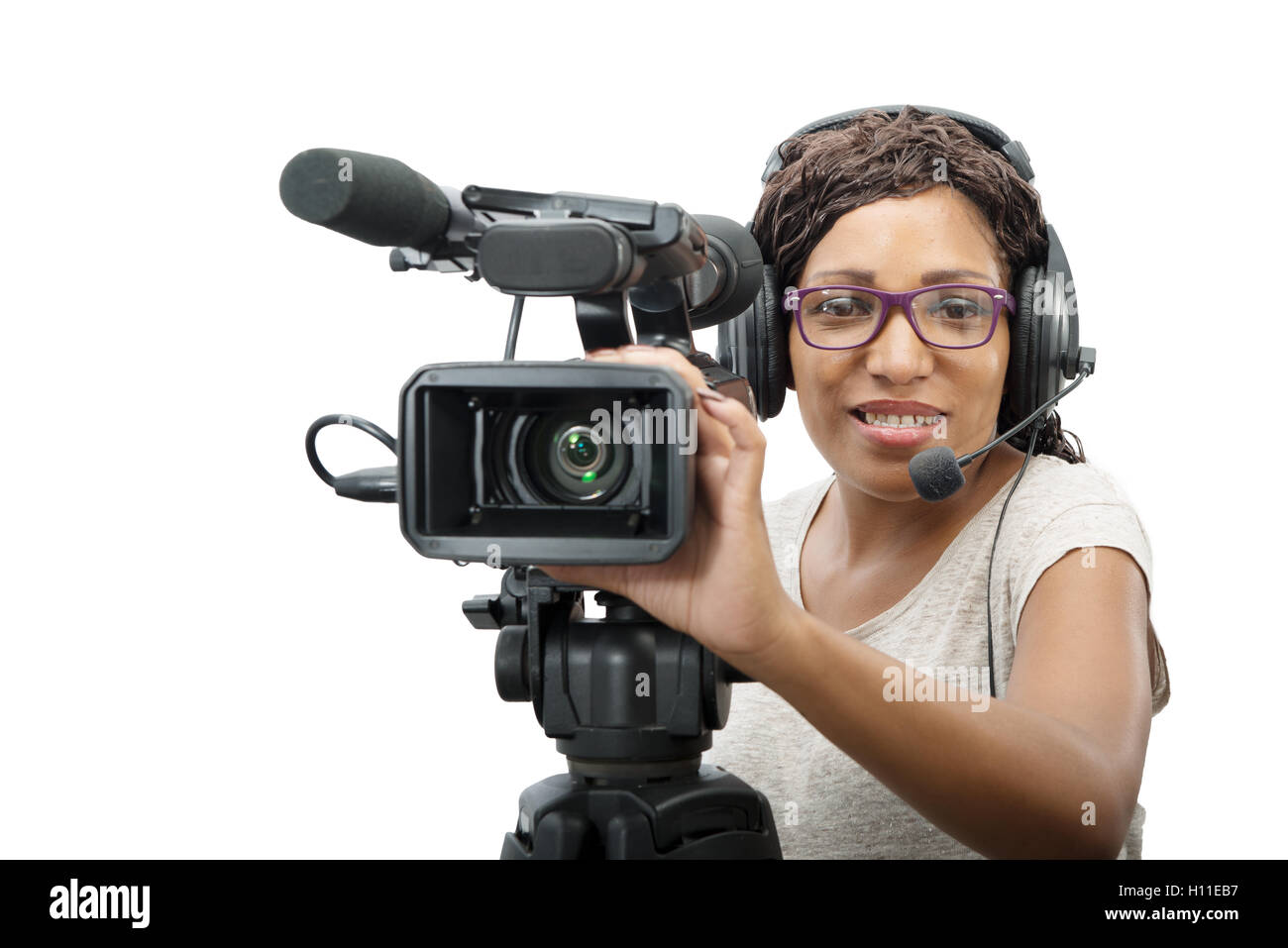 a young African American women with professional video camera and ...
