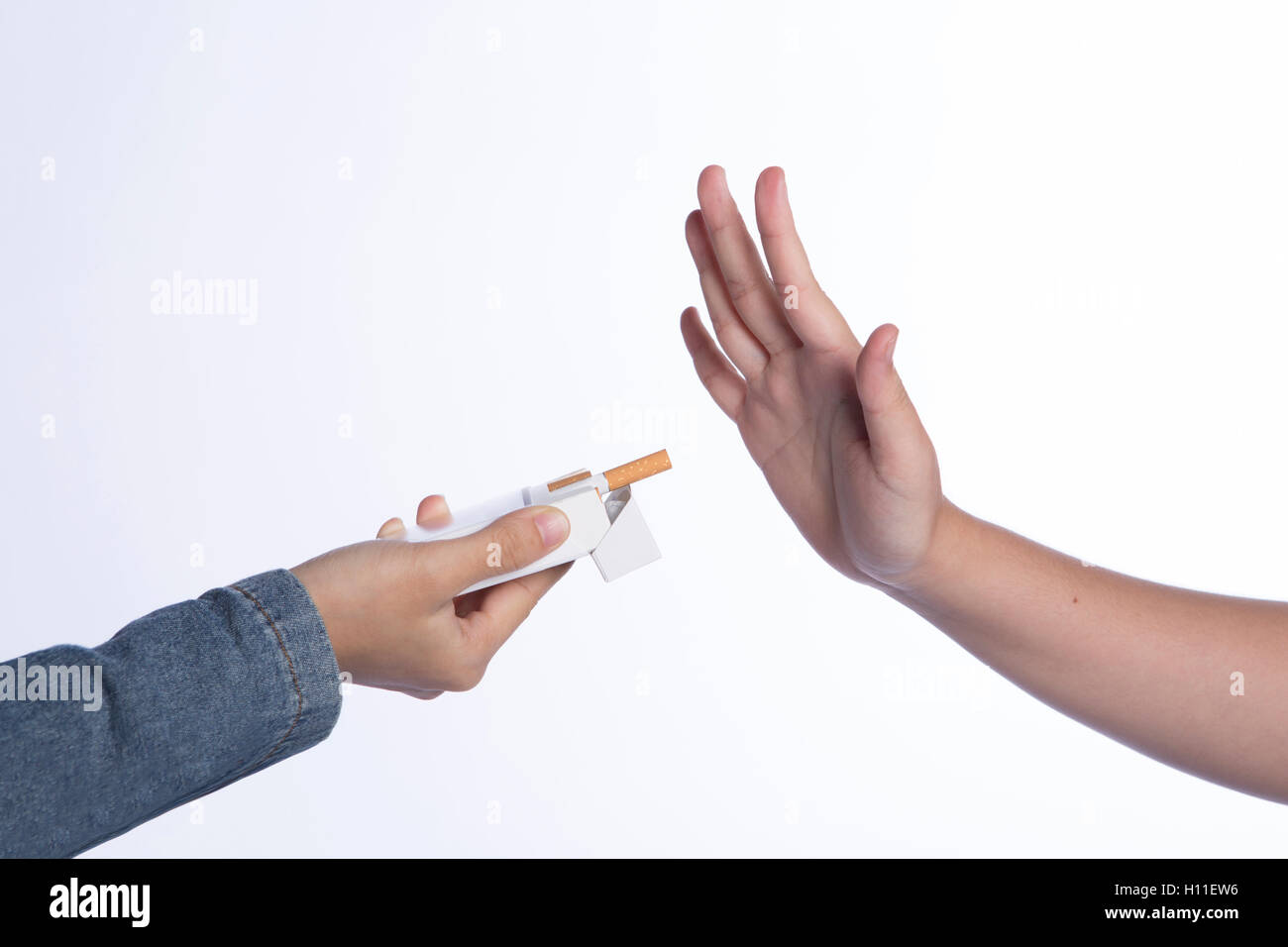 No smoking sign, a hand refusing cigarette offered by others for health ...