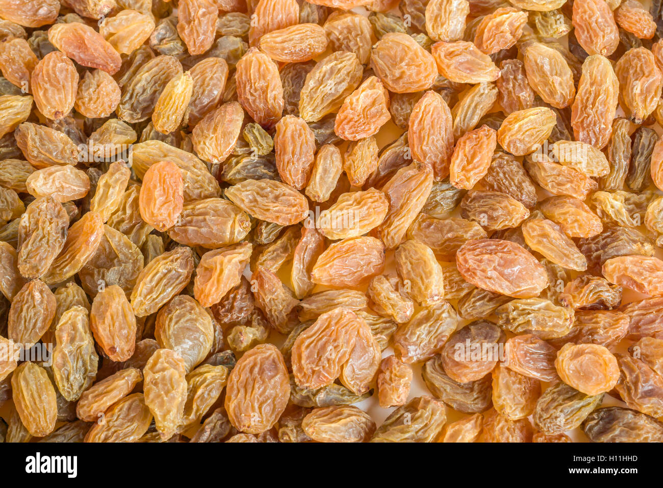 Golden raisins background (top view Stock Photo - Alamy