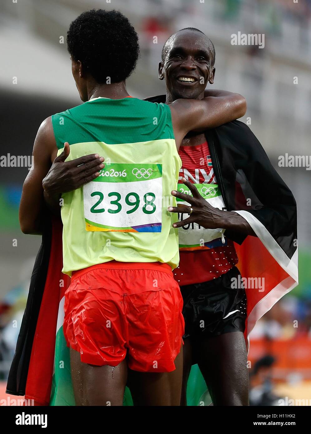 Eliud Kipchoge (right) of Kenya hugs Feyisa Lilesa of Ethiopia after ...