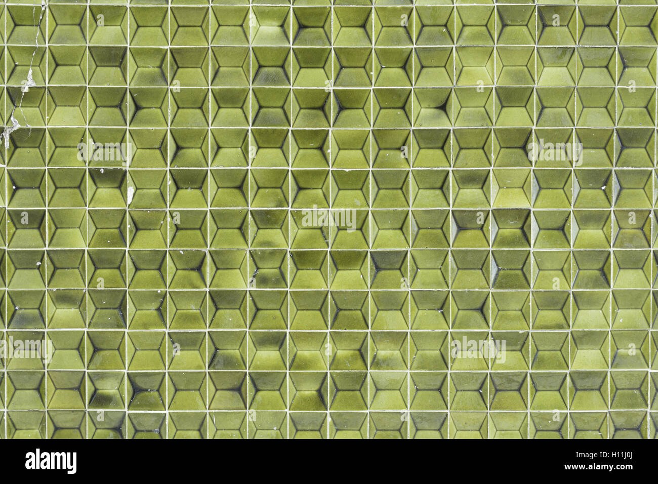 Bright green tiles in front of building constuccion Stock Photo - Alamy