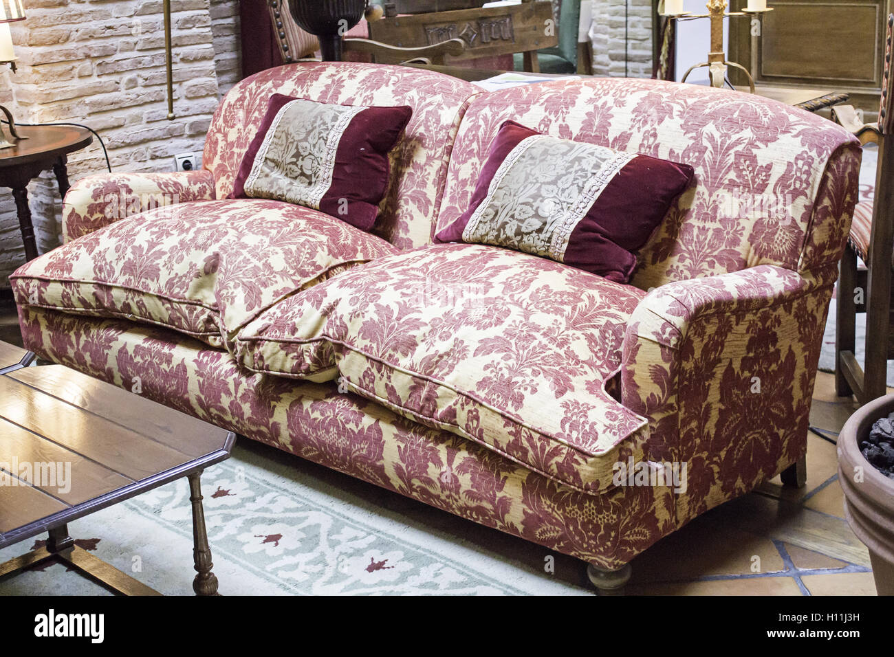 Patterned sofa with cushions home interior Stock Photo - Alamy