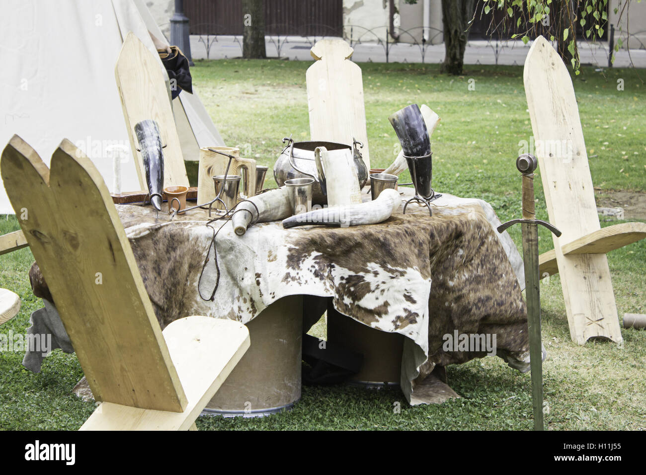 Table medieval weapons and skins, celebration Stock Photo - Alamy