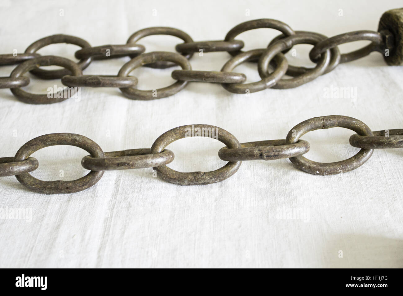 Rusty iron chains and old objects Stock Photo - Alamy