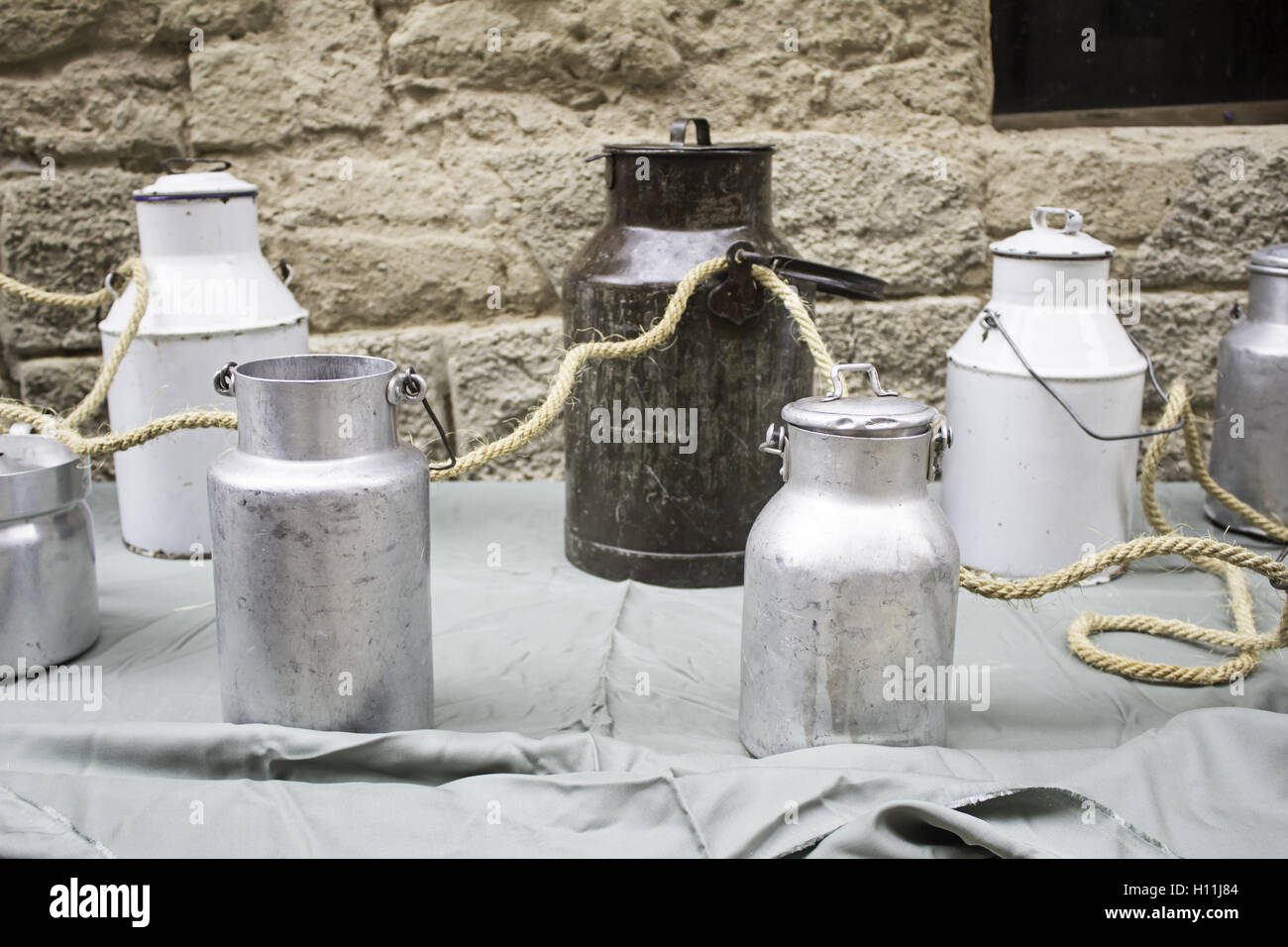 Old metal milk bottles urban street objects Stock Photo - Alamy