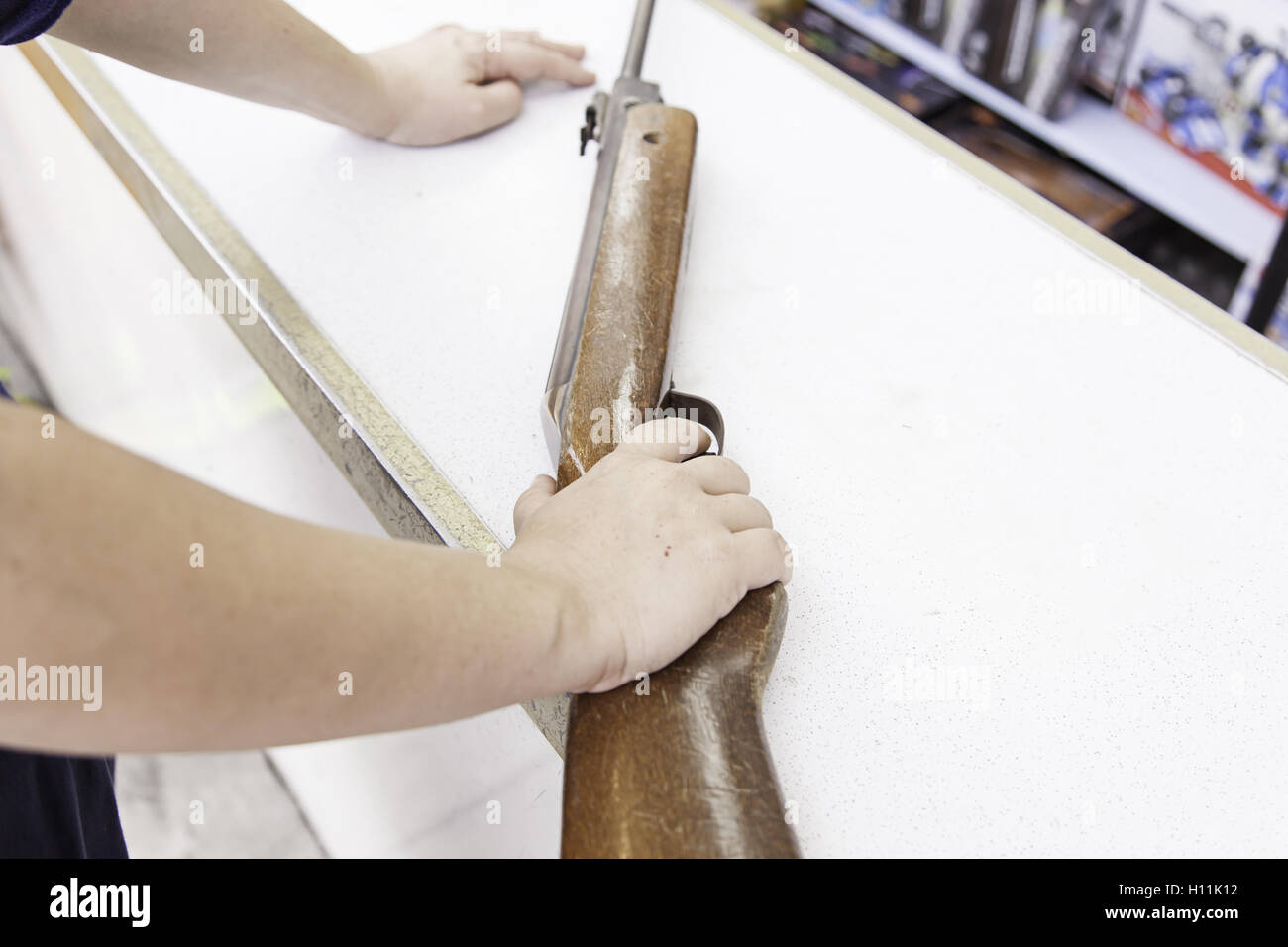 Girl show with shotgun shooting, fun Stock Photo - Alamy