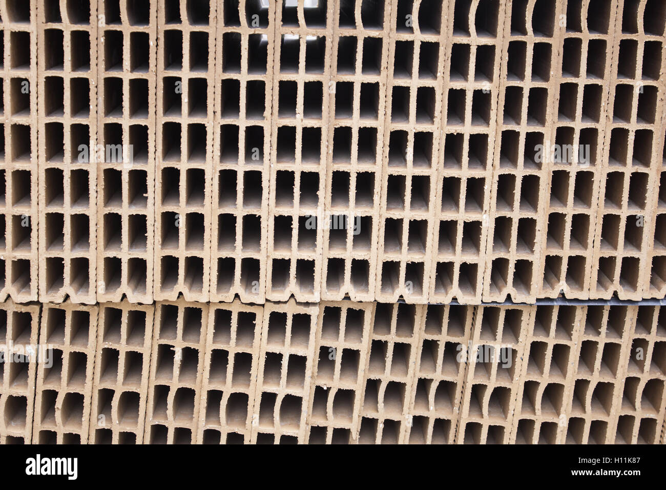 Clay bricks stacked in urban structure Stock Photo - Alamy