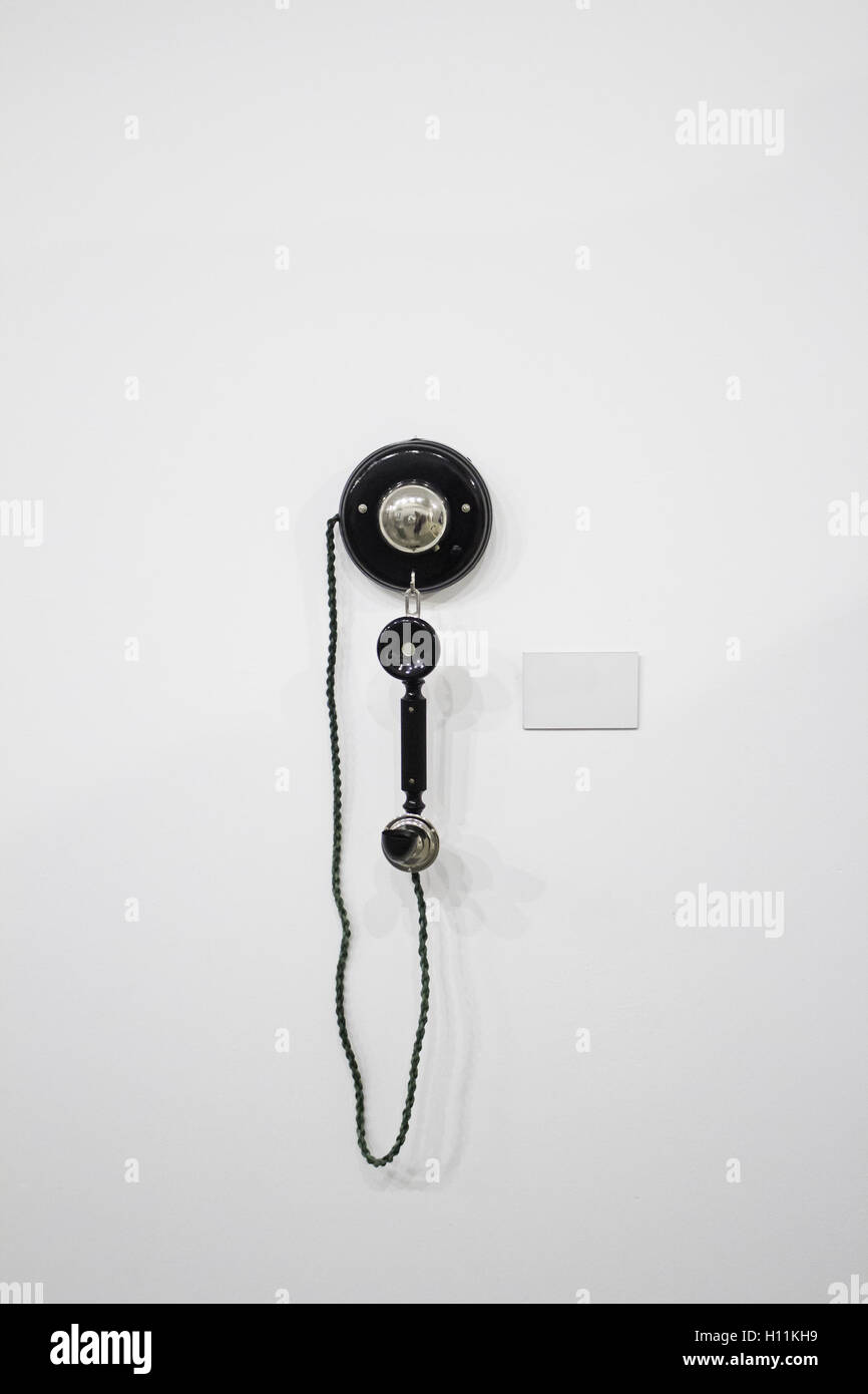 Phone hanging on wall of old plastic, technology Stock Photo - Alamy