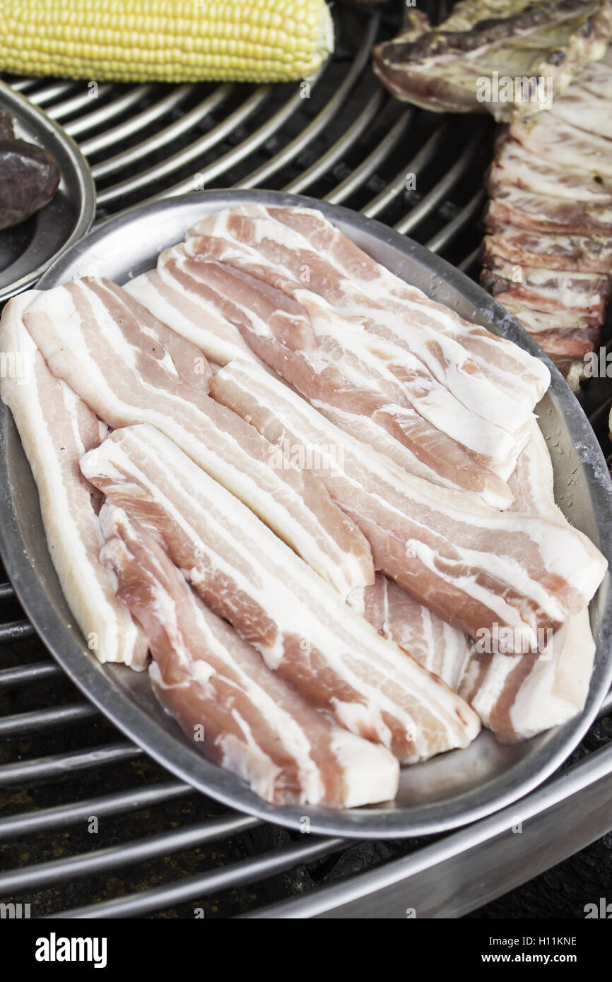 Raw bacon tray restaurant, food and hospitality Stock Photo - Alamy