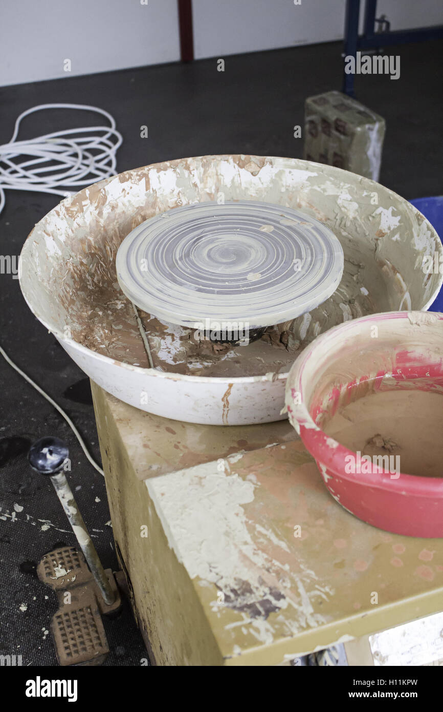 Working with machine and ceramic clay craft Stock Photo - Alamy
