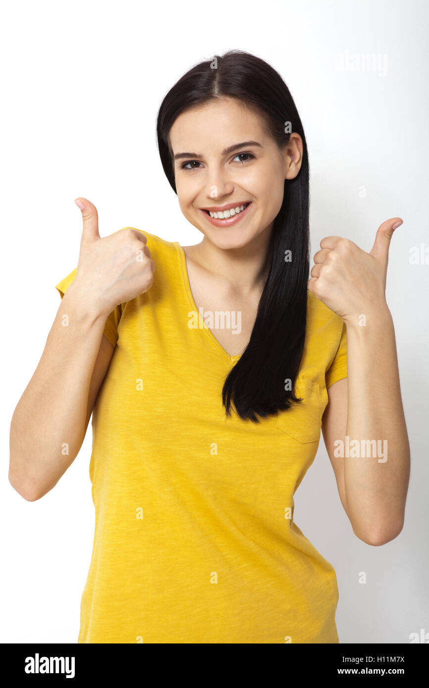 Happy attractive young woman showing thumbs up, okay. Isolated Stock ...