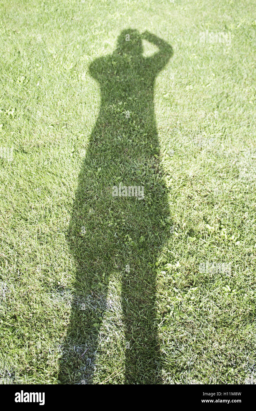 Shadow girl in grass, nature and outdoors Stock Photo - Alamy