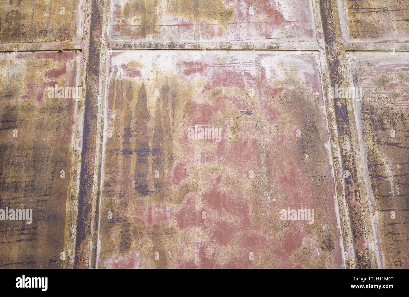 Rusted and damaged red door, construction Stock Photo - Alamy