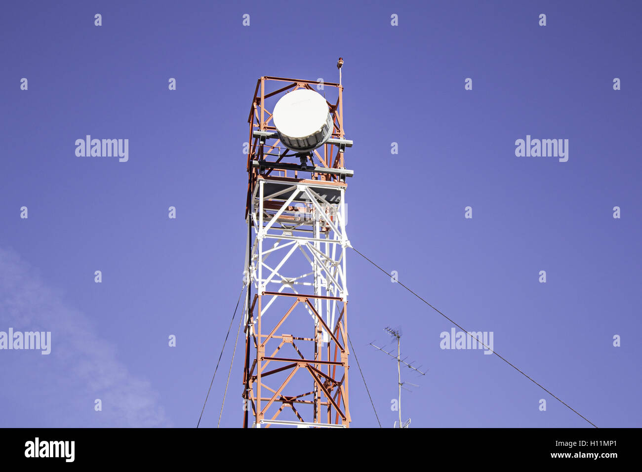 Phone tower in town, communication and energy Stock Photo - Alamy