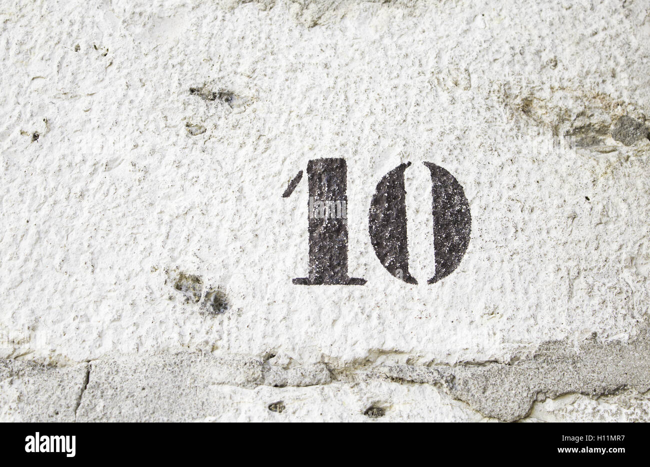 Number ten grungy urban wall construction Stock Photo - Alamy