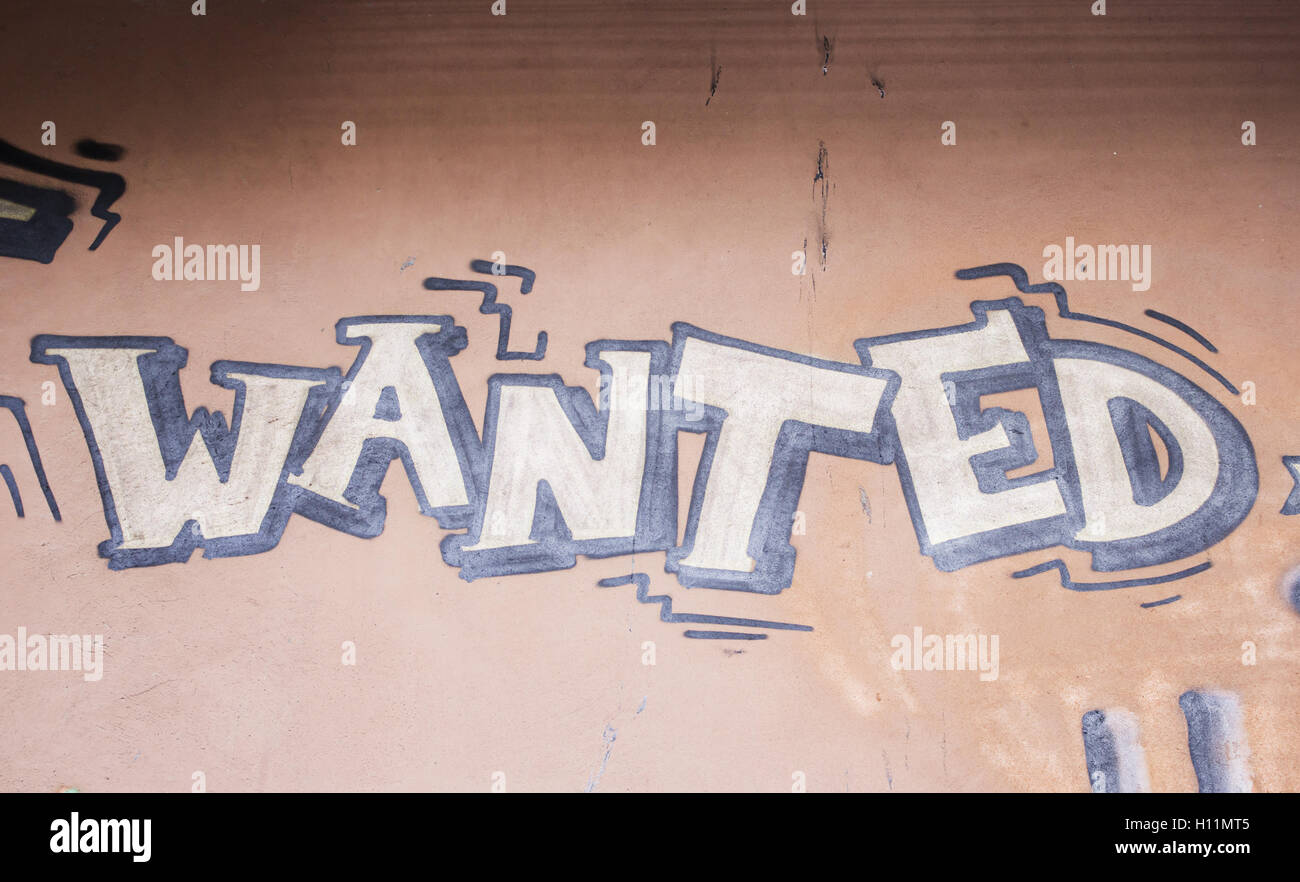 Drawn wanted poster on the wall, graffiti symbol Stock Photo - Alamy