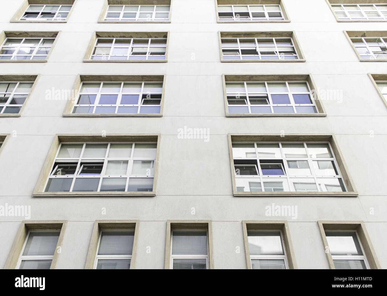 Apartment windows urban street construction Stock Photo - Alamy
