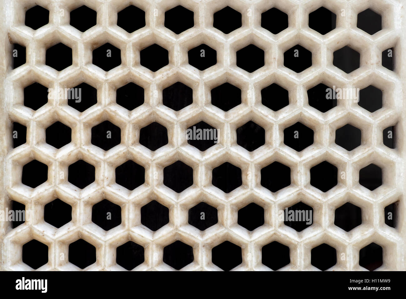 Honey comb style holes abstract texture background Stock Photo - Alamy