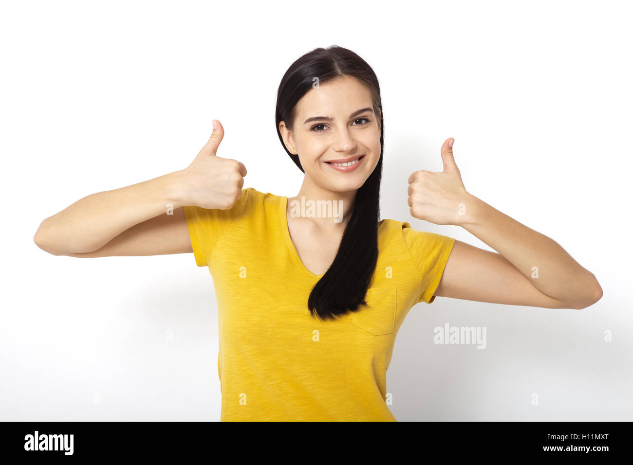Happy attractive young woman showing thumbs up, okay. Isolated Stock ...