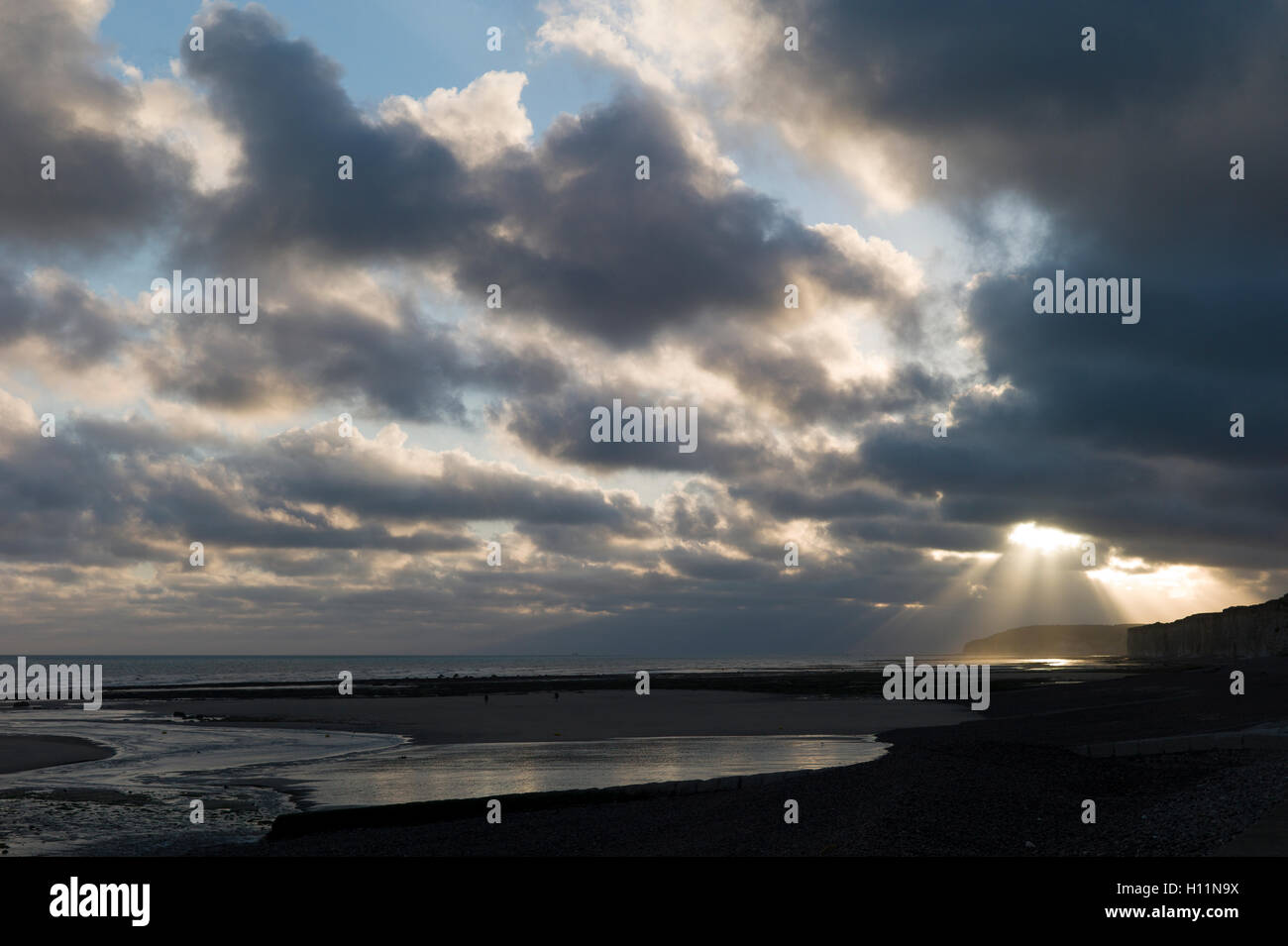 Sun rays through dark clouds hi-res stock photography and images - Alamy