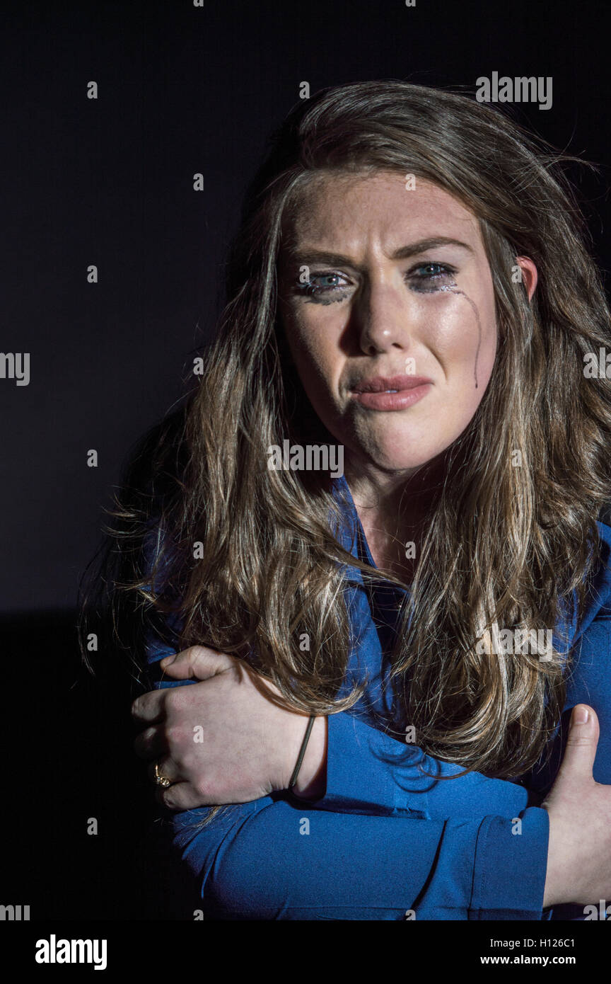 Studio portrait of young woman crying Stock Photo - Alamy