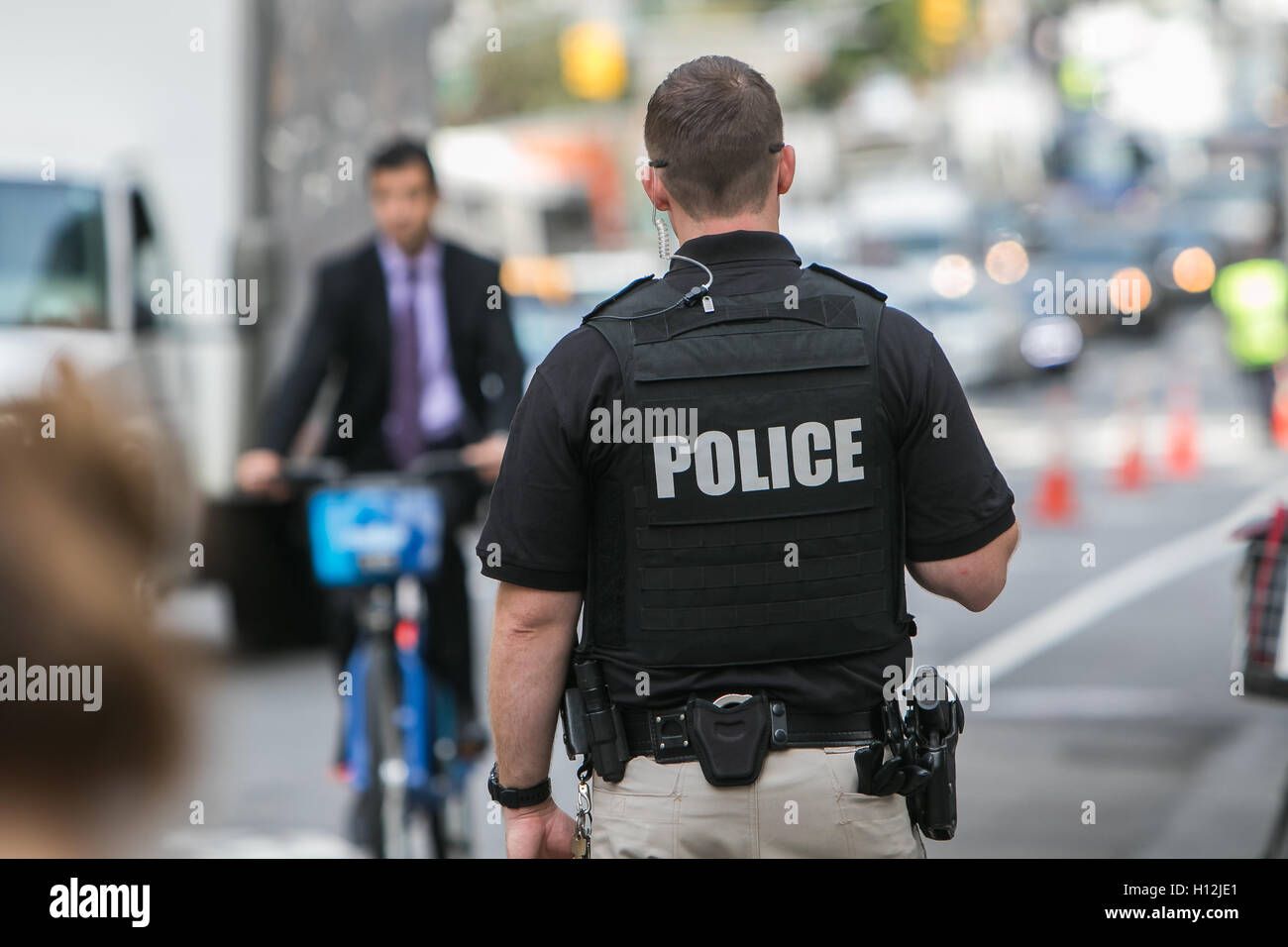 A Secret Service agent is helping direct traffic and keep the reserved ...