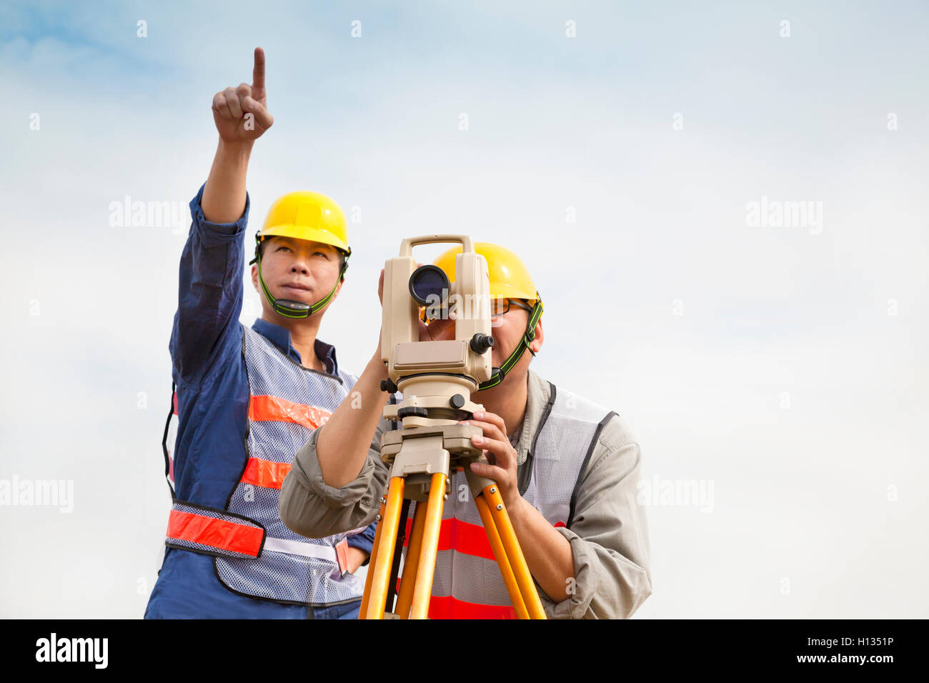 Surveyor engineer making measure with partner Stock Photo - Alamy Surveyor engineer making measure with partner Stock Photo - Alamy