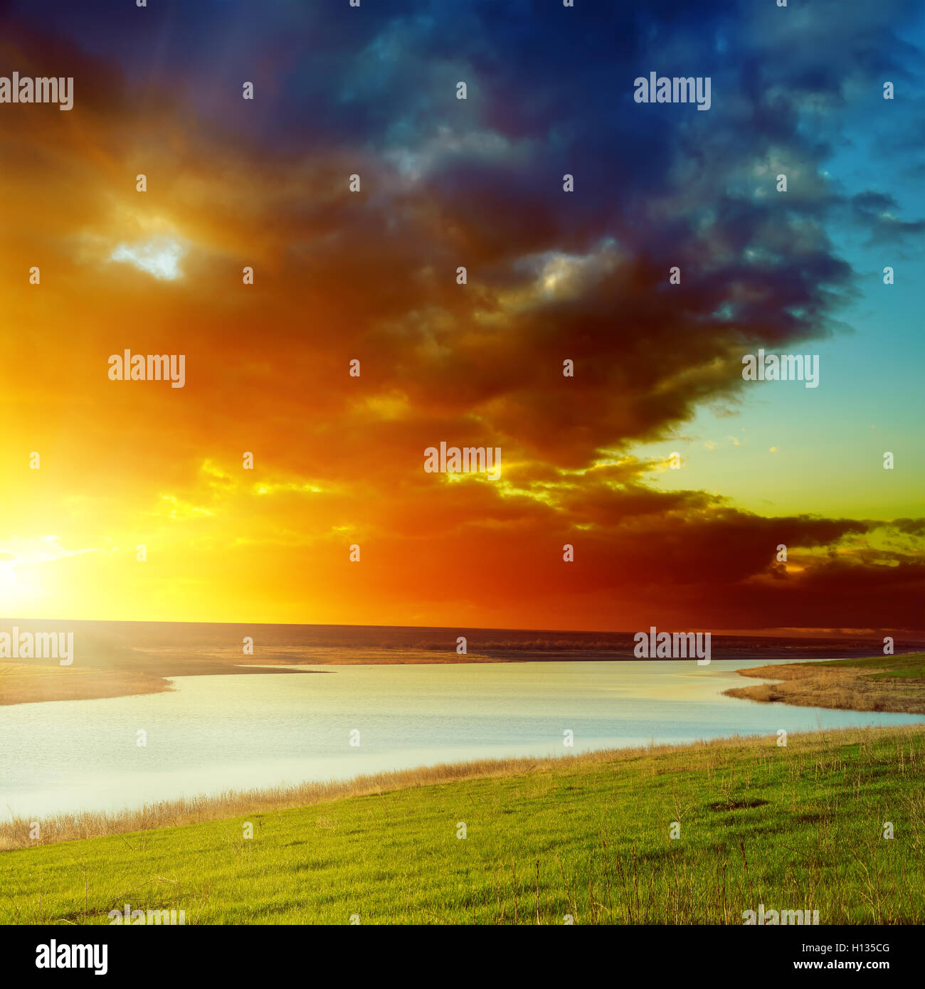 orange sunset over river Stock Photo - Alamy