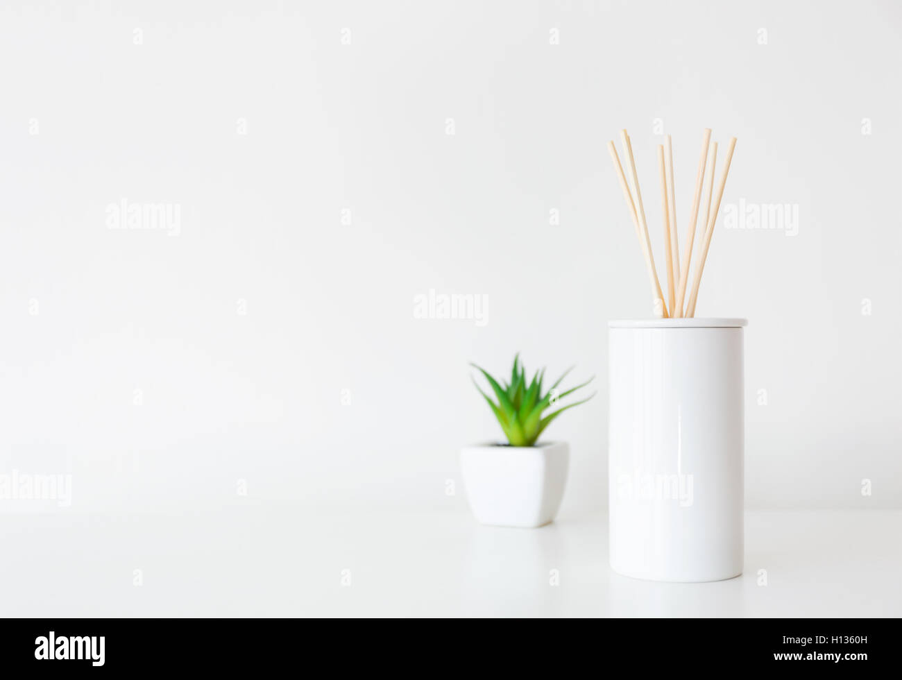 Home diffuser and potted plant Stock Photo - Alamy