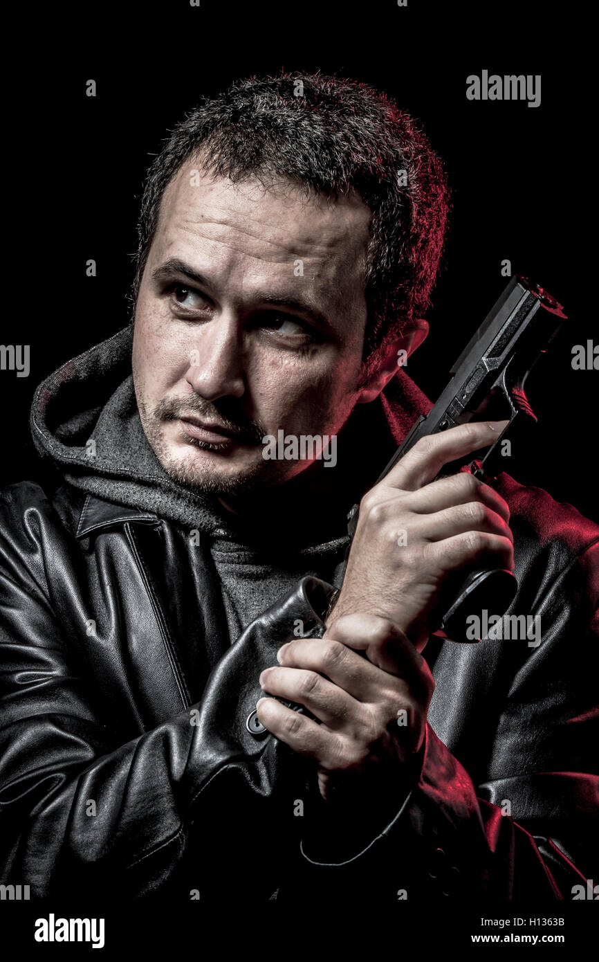 thief, armed man with black leather jacket, dangerous Stock Photo - Alamy