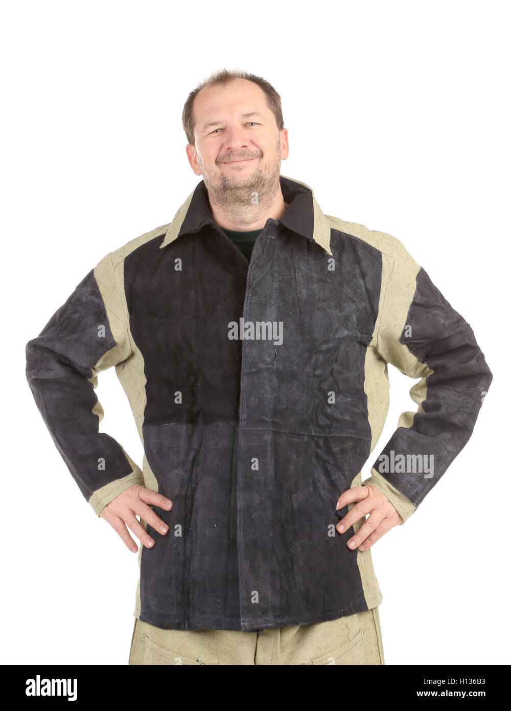 Confident welder with arms on waist Stock Photo - Alamy