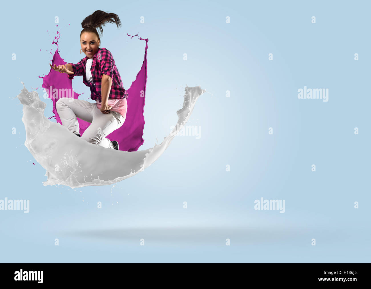 young female dancer jumping with splash of paint Stock Photo - Alamy