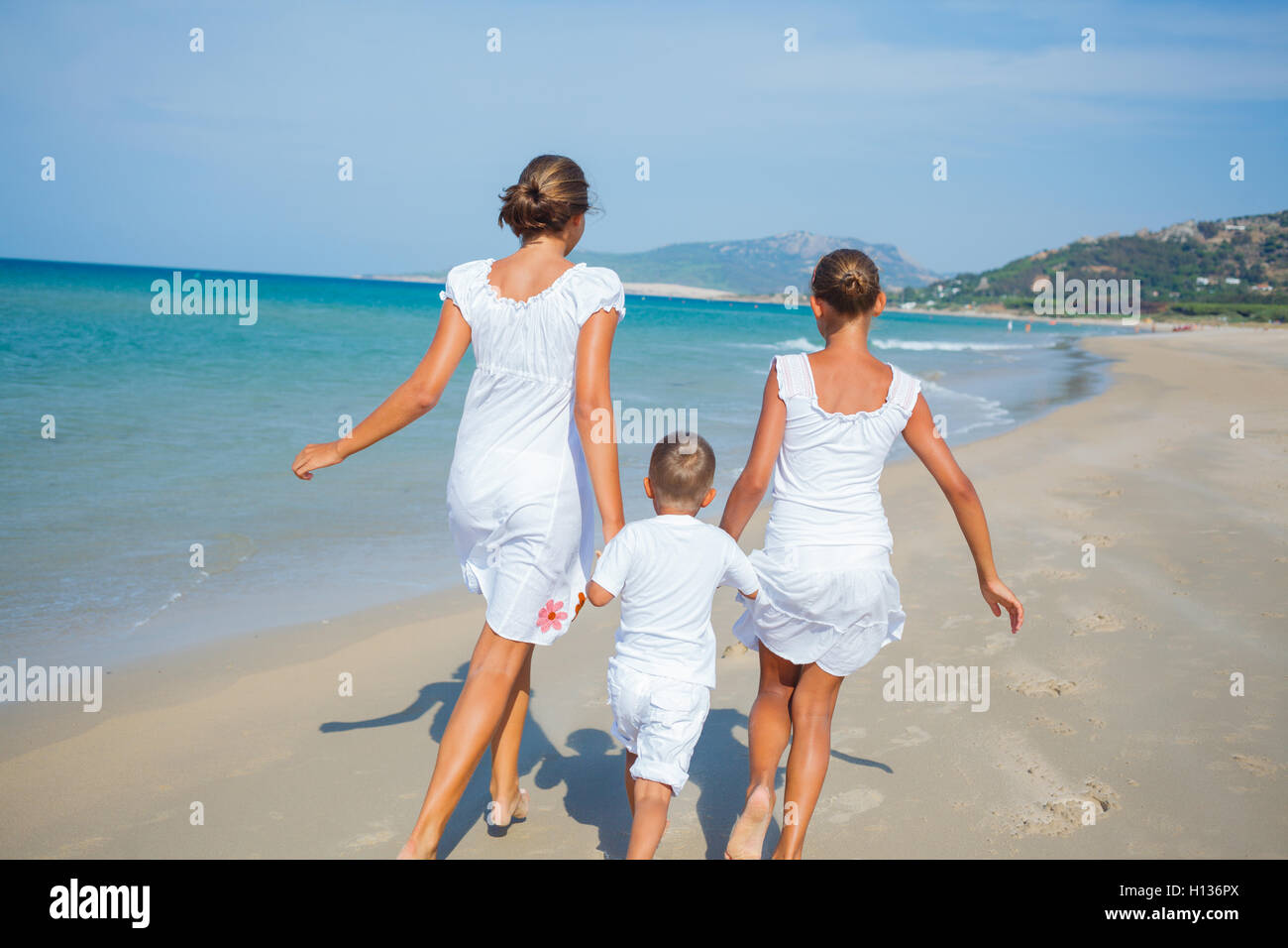 Cute kids on the beach hi-res stock photography and images - Alamy