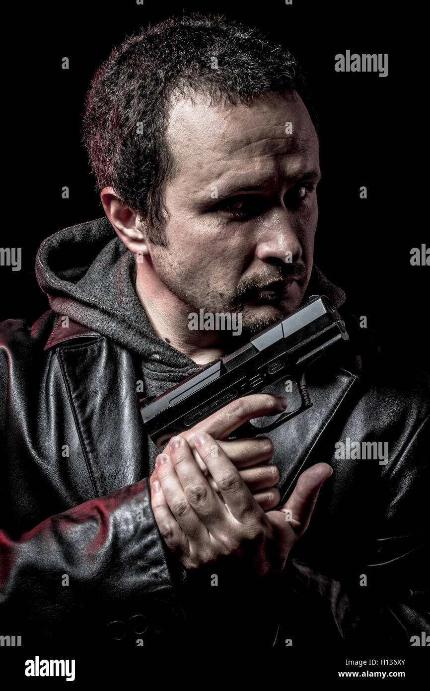 Security, thief, armed man with black leather jacket, dangerous Stock ...