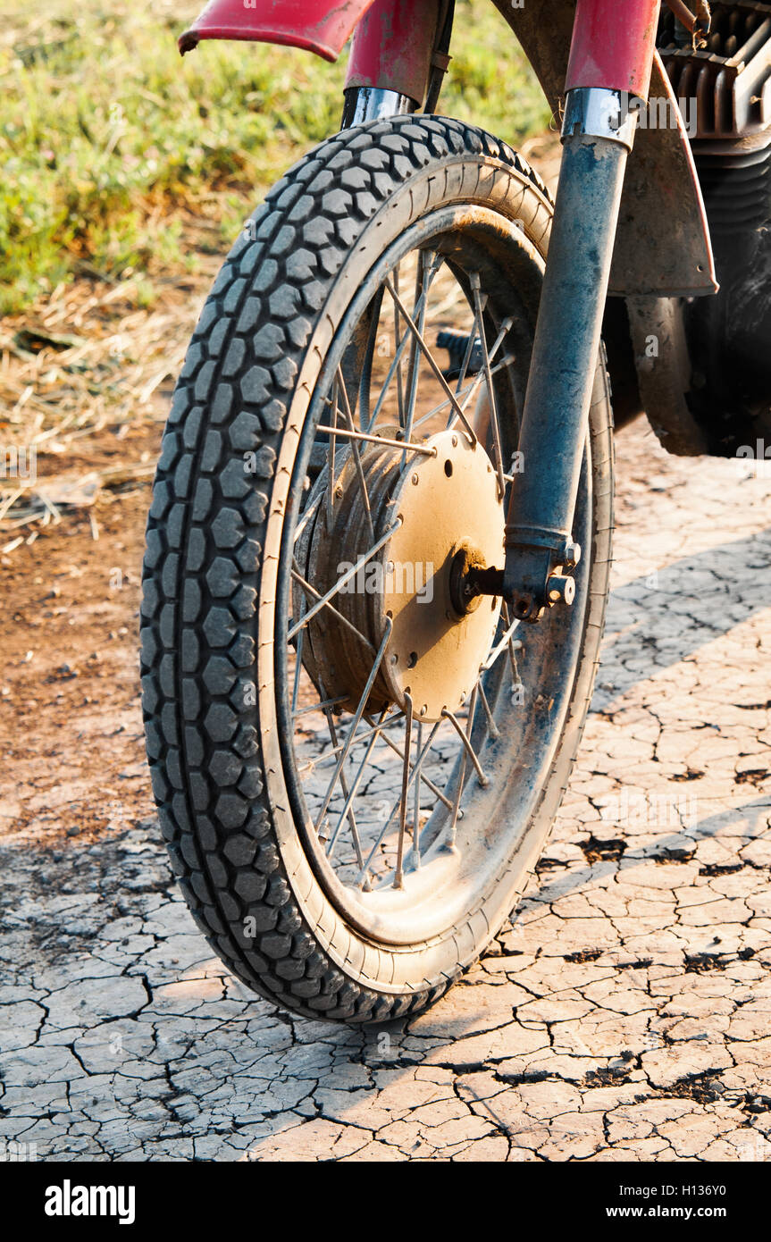 Old wheel motorcycle on a dirt road Stock Photo - Alamy