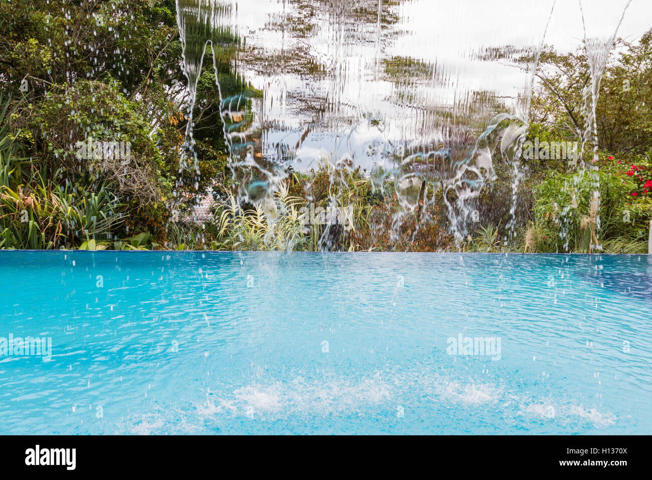 relaxing swimming pool with a waterfall in a tropical rain forest Stock ...